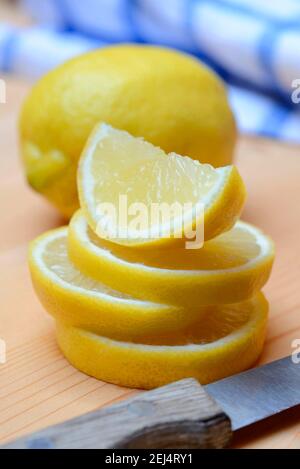 Lemon quarter slice (Citrus limon) isolated on white Stock Photo - Alamy
