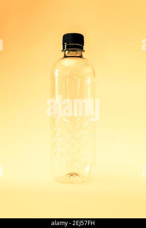 An empty generic single use plastic water bottle on a white background ...