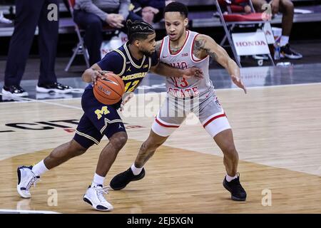 Michigan guard Mike Smith (12) dribbles the ball during the first half ...