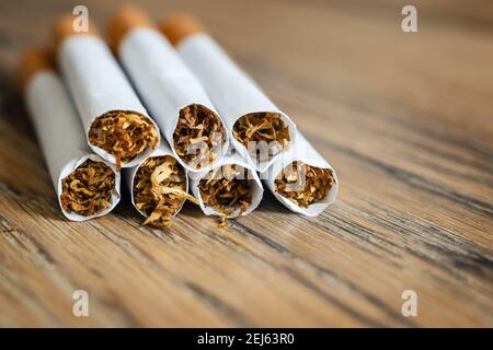 Close up of a hndmade smoking cigarettes on wooden background Stock ...