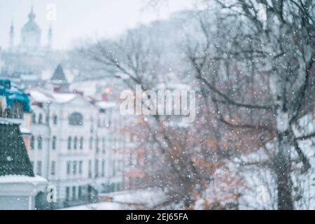 Copious snowfall over the city with the roofs Stock Photo - Alamy