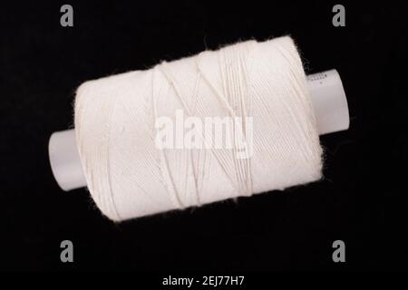 colored threads on a black background Stock Photo - Alamy