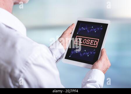 Tablet screen displaying a closed stock market concept Stock Photo - Alamy