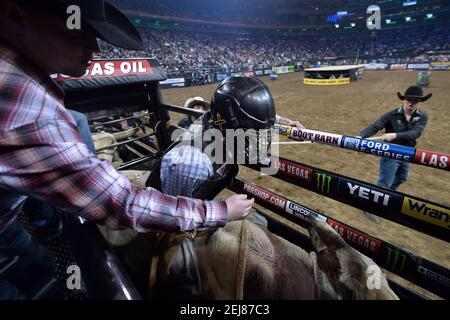 Professional bull rider Brady Fielder rides ”Chuck & Larry” during ...