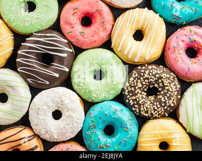 Donuts glazed with various sprinkles Stock Photo - Alamy