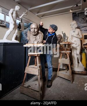 Sculptor Andrian Melka at his studio in York, working on a clay ...