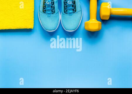 Athlete equipment with dumbbells and sneakers. Overhead view Stock ...