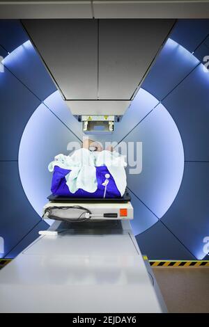 Proton therapy irradiates cancer cells with a beam of protons inside ...