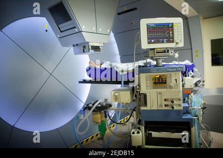 Proton therapy irradiates cancer cells with a beam of protons inside ...