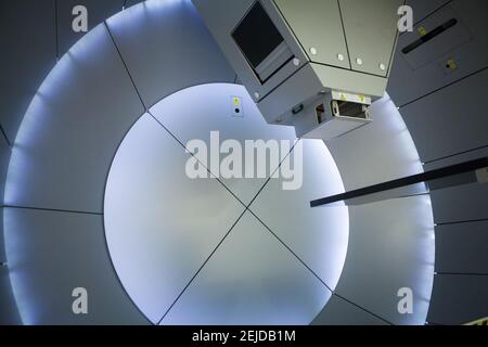 Proton therapy irradiates cancer cells with a beam of protons inside ...