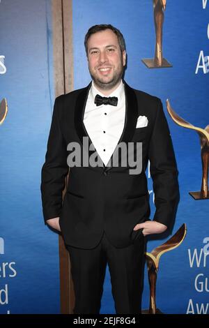 Benjamin Klein walks the carpet at the 2020 Writers Guild Awards held ...