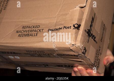 Repacked post package from DHL Stock Photo - Alamy