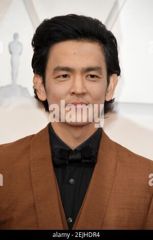 John Cho and his wife actress Kerri Higuchi walking on the red carpet ...
