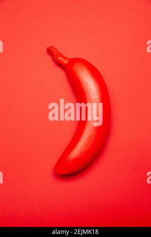 Red colored tropical banana on bright surface Stock Photo - Alamy