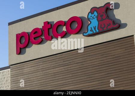 A logo sign outside of a Petco retail store location in Baltimore ...