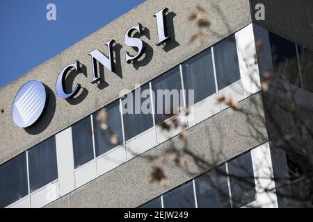 A logo sign outside of the headquarters of CNSI in Rockville, Maryland ...