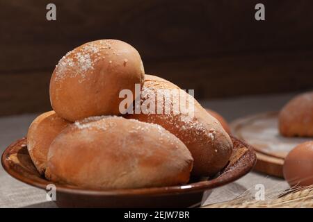 Delicious pies in a plate freshly cooked - Wooden Background Stock ...