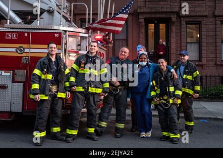 FDNY members from Engines 219, 220, and 240 in Brooklyn pose with a ...