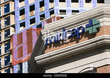 A logo sign outside of the headquarters of MidCap Financial Services in ...