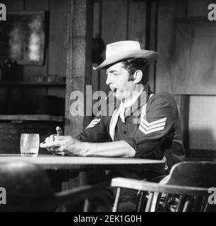 DEAN MARTIN on set candid smoking cigar and drinking whiskey during ...