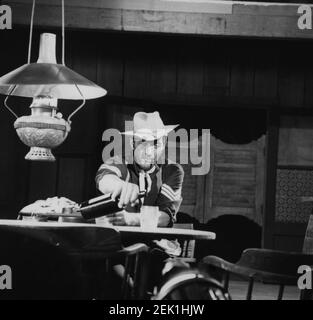 DEAN MARTIN on set candid smoking cigar and drinking whiskey during ...