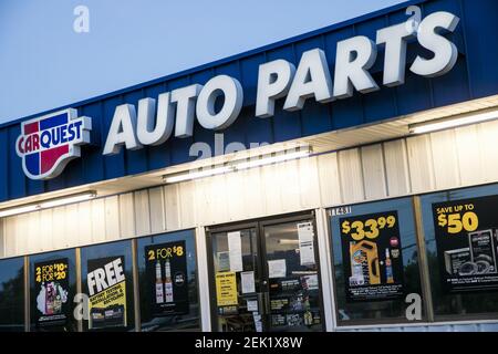 A logo sign outside of a Carquest Auto Parts retail store location in ...