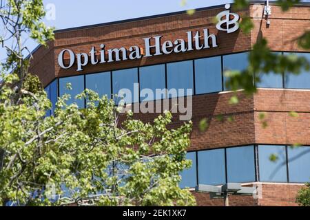 A logo sign outside of the headquarters of Optima Health in Virginia ...