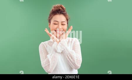 Photo portrait of excited girl holding yellow phone in two hands with ...