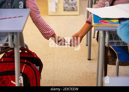 Children cheating in a school classroom Stock Photo - Alamy