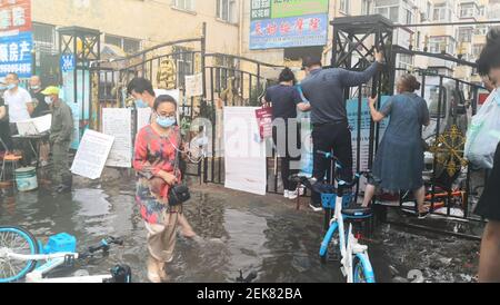 HARBIN, CHINA - JULY 3, 2020 - Trees are blown down and roads become ...