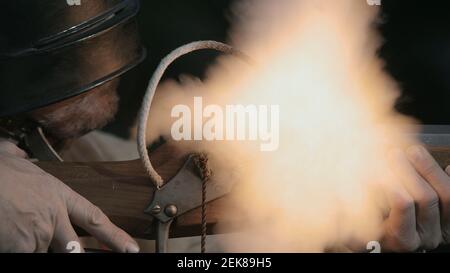 Medieval handgunner fires his matchlock musket Stock Photo - Alamy