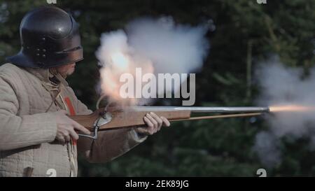 Medieval handgunner fires his matchlock musket Stock Photo - Alamy