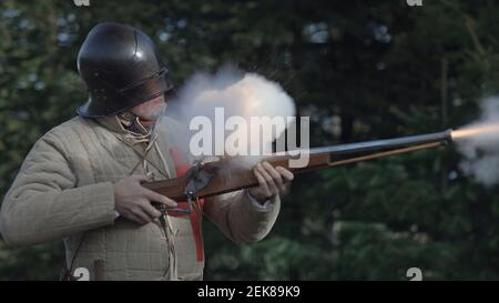 Medieval handgunner fires his matchlock musket Stock Photo - Alamy