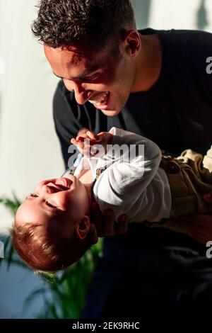 baby boy laughing while playing with his parents Stock Photo - Alamy
