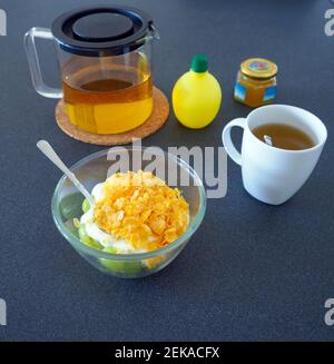 Sugar free cornflakes bowl on wooden table served with berries, coffee ...