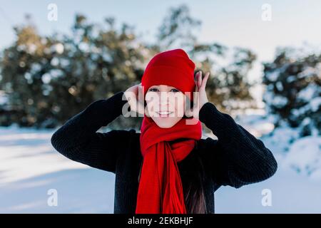 Beautiful hispanic woman wearing red diadem showing and pointing up ...