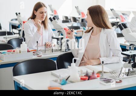 Young scientist sitting in the classroom Stock Photo - Alamy
