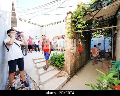 Local citizens and even tourists flock to see the house, which tightly ...