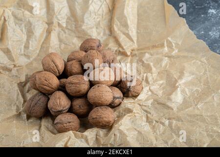 Many of healthy walnuts on a parchment paper Stock Photo - Alamy