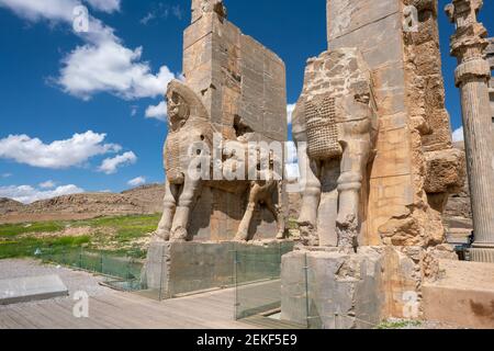 Ruins, statues and murals of ancient persian city of Persepolis in Iran ...