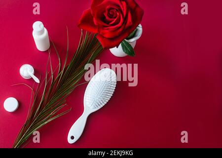 Composition with hair brush and cosmetics on light background Stock ...