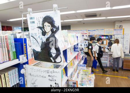 Mangas on display in a manga bookstore in Ikebukuro. Manga themed ...