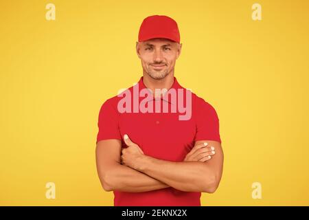 Cool and confident. Confident man keep arms crossed yellow background ...