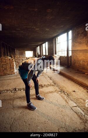 African American male model crouching like a gangster isolated on white ...