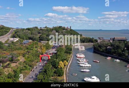 --FILE--Landscape photos of tourists enjoying good weather and ...