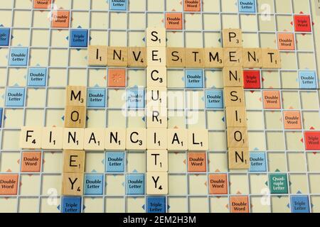 scrabble board game tiles money pound Stock Photo - Alamy