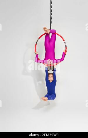 Performance by a circus acrobat artist. Girls perform aerial acrobatic ...