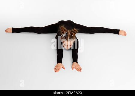 child girl sitting on a transverse twine Stock Photo - Alamy
