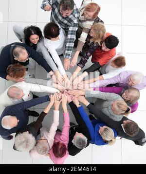 group of older people joining their palms together Stock Photo - Alamy