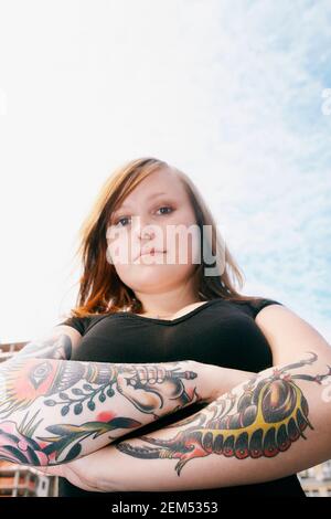 Young latin woman standing at art studio stressed and frustrated with ...